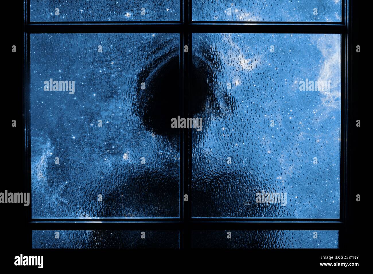 Dark silhouette of child alone in isolation behind glass door. Abstract ...