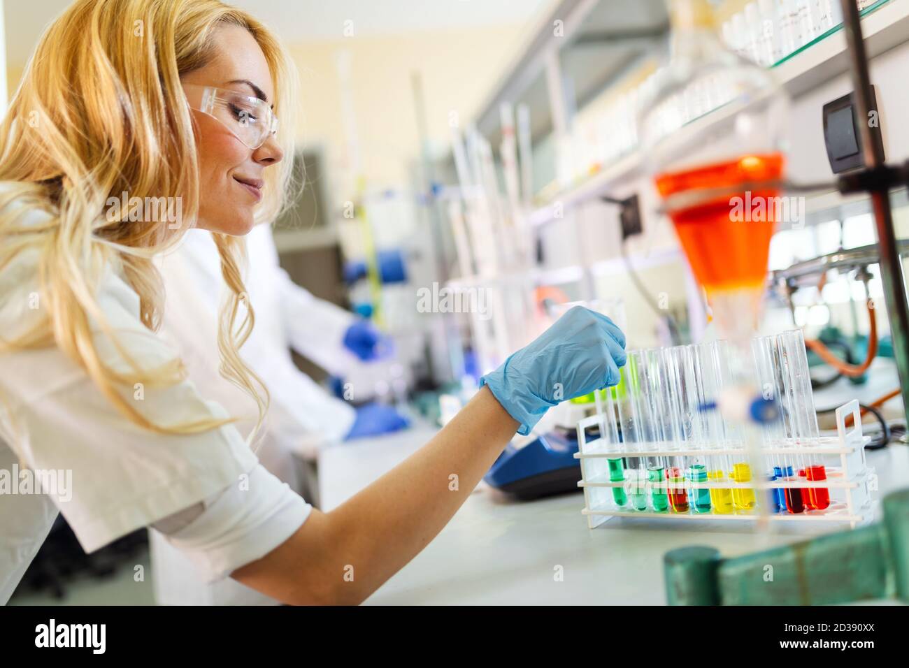 Young attractive female scientist researching in the laboratory Stock ...