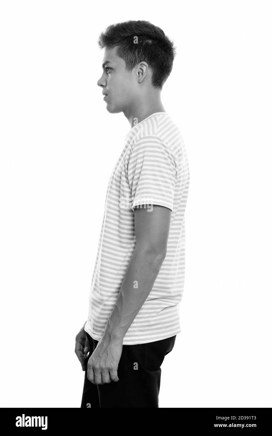 Profile view of young handsome man standing Stock Photo - Alamy