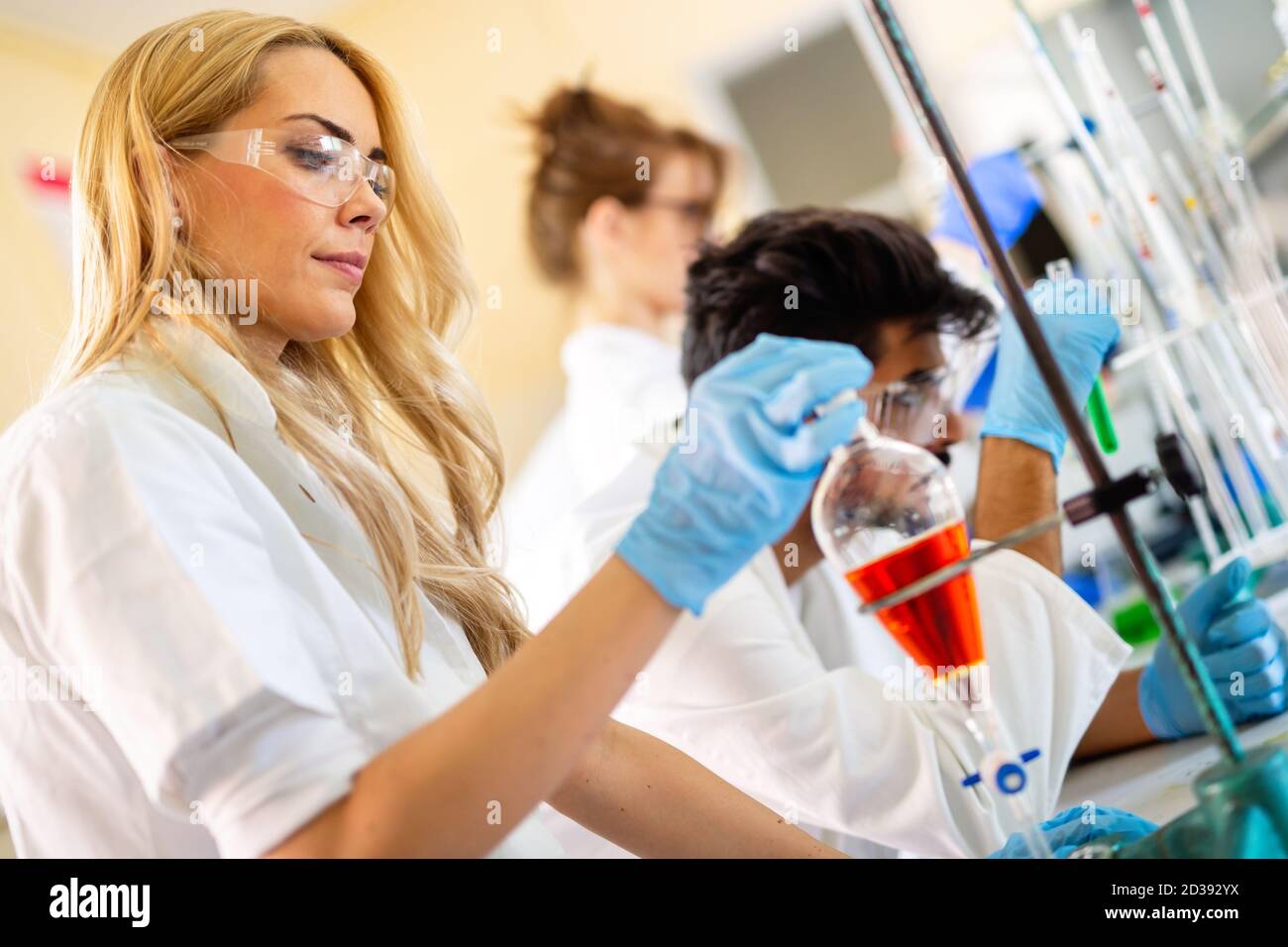 Group of medical scientists working at the laboratory. Research virus ...