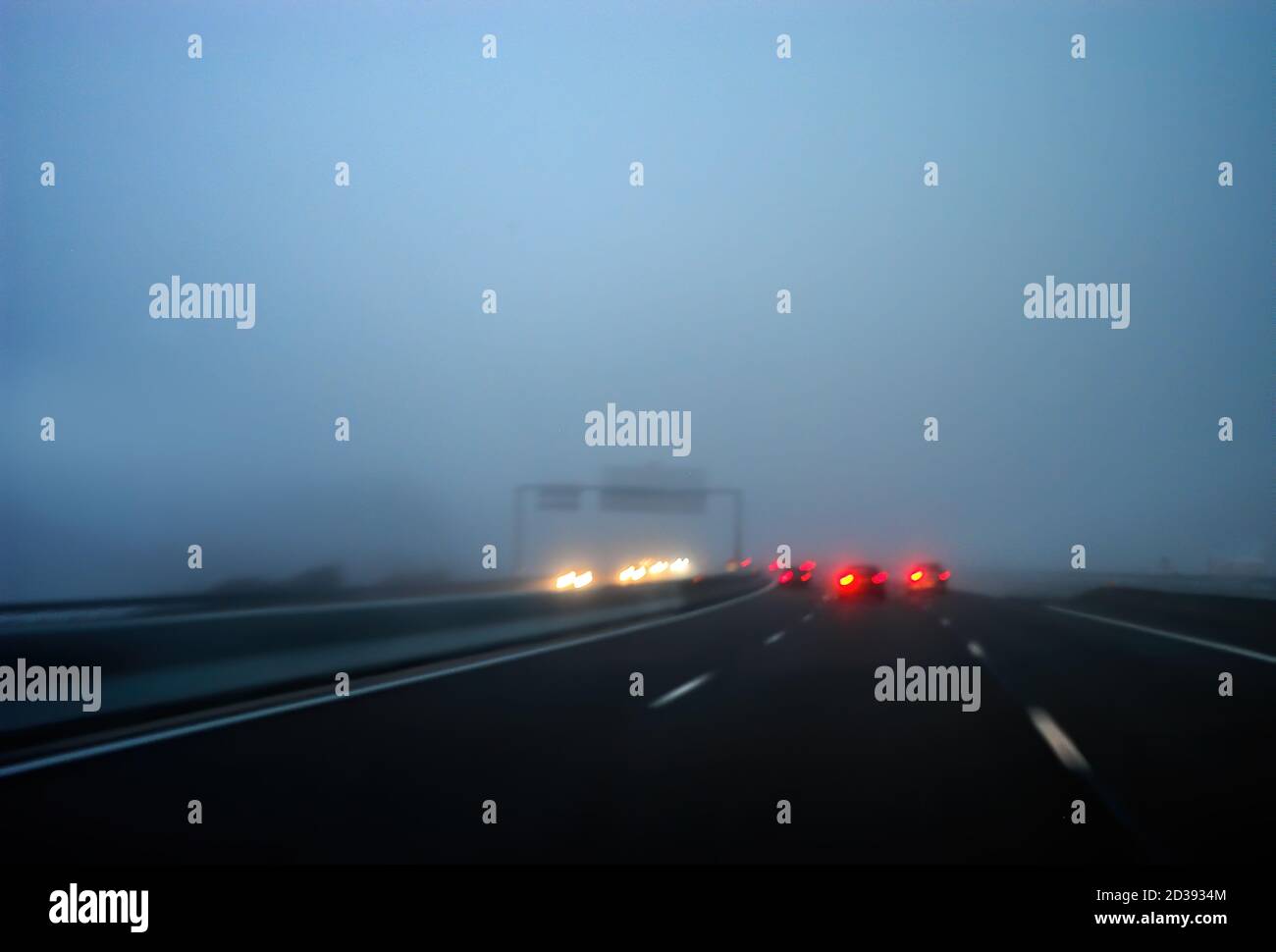 drivers view of fog on a dark motorway Stock Photo - Alamy