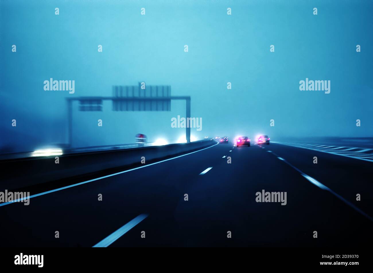drivers view of fog on a dark motorway Stock Photo - Alamy