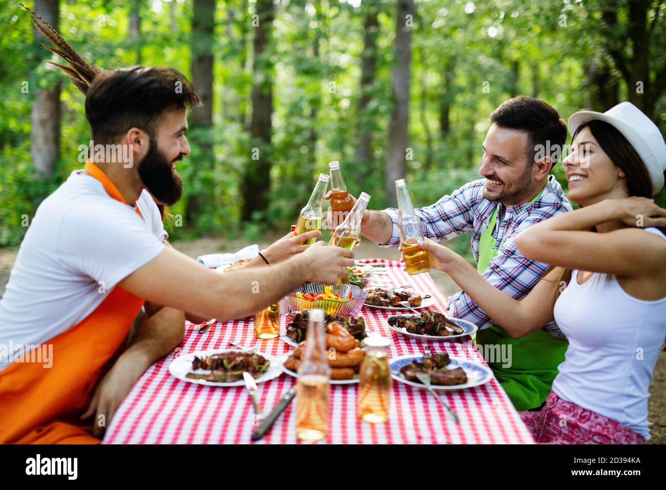 Friends having fun in nature doing bbq Stock Photo - Alamy