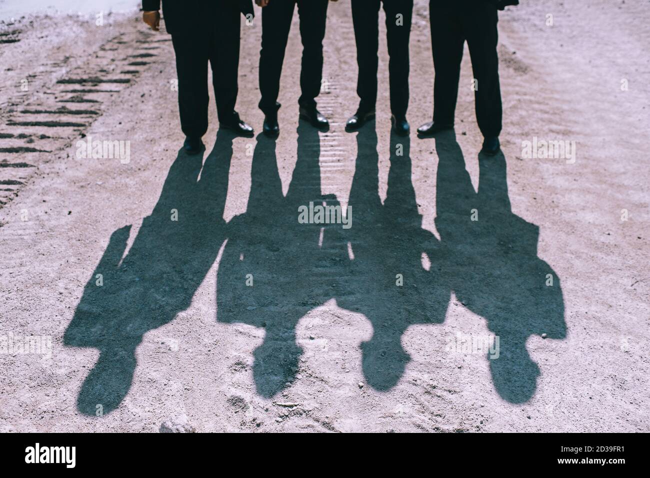 Shadow of a group of faceless business people or groom with friends in ...
