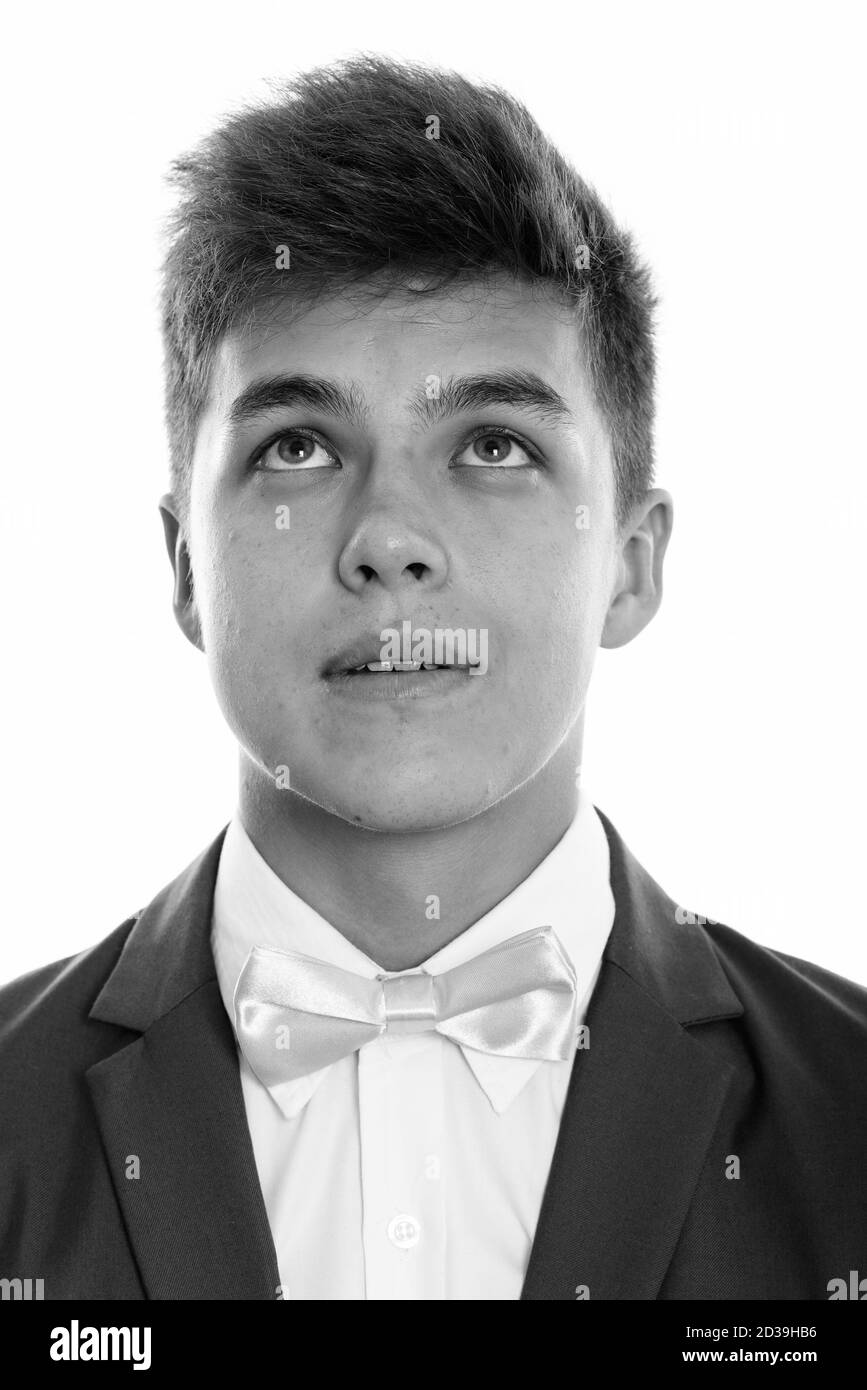 Face of young handsome man thinking while looking up Stock Photo - Alamy