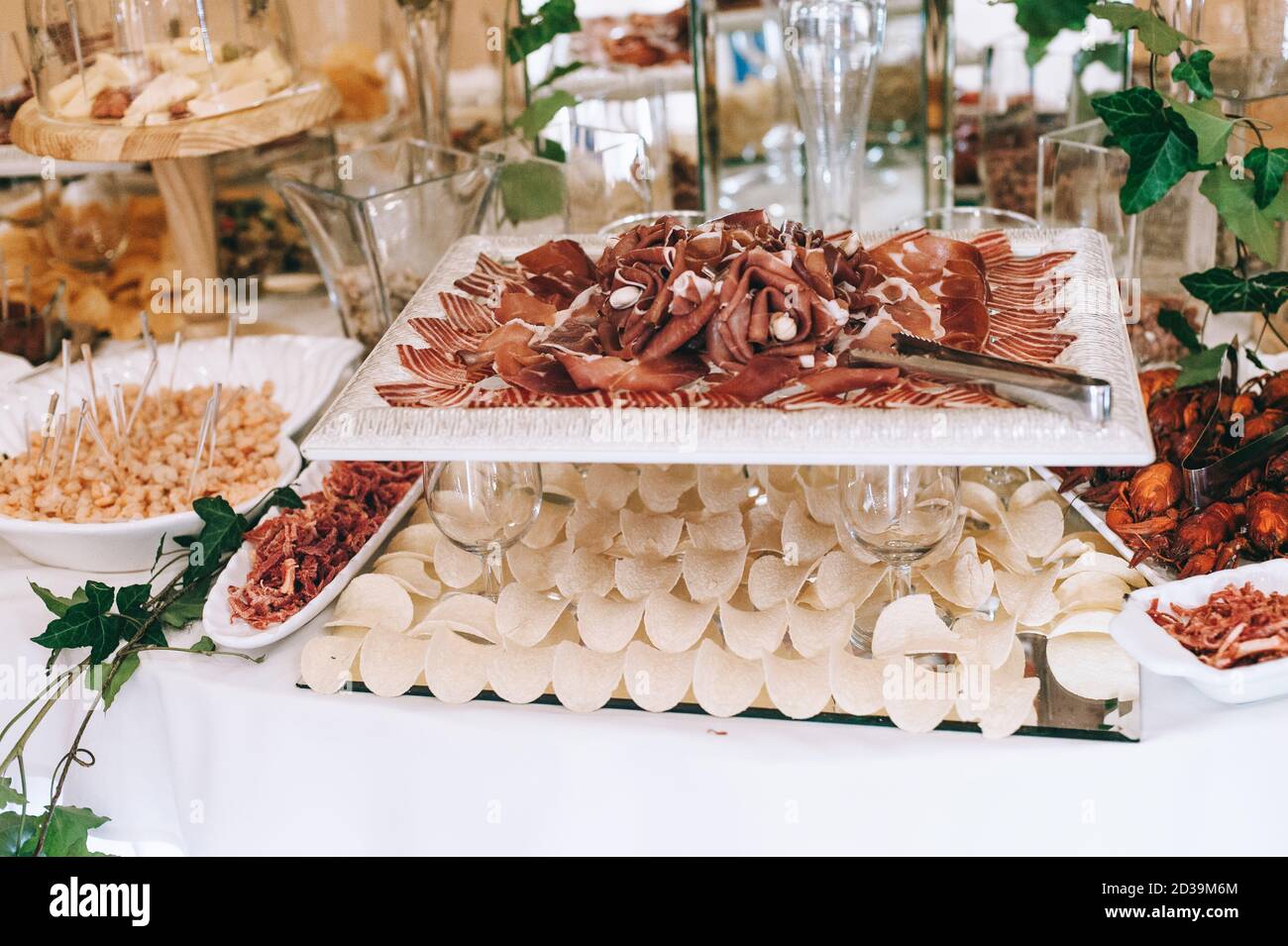 Beautifully decorated catering banquet table with different food snacks ...