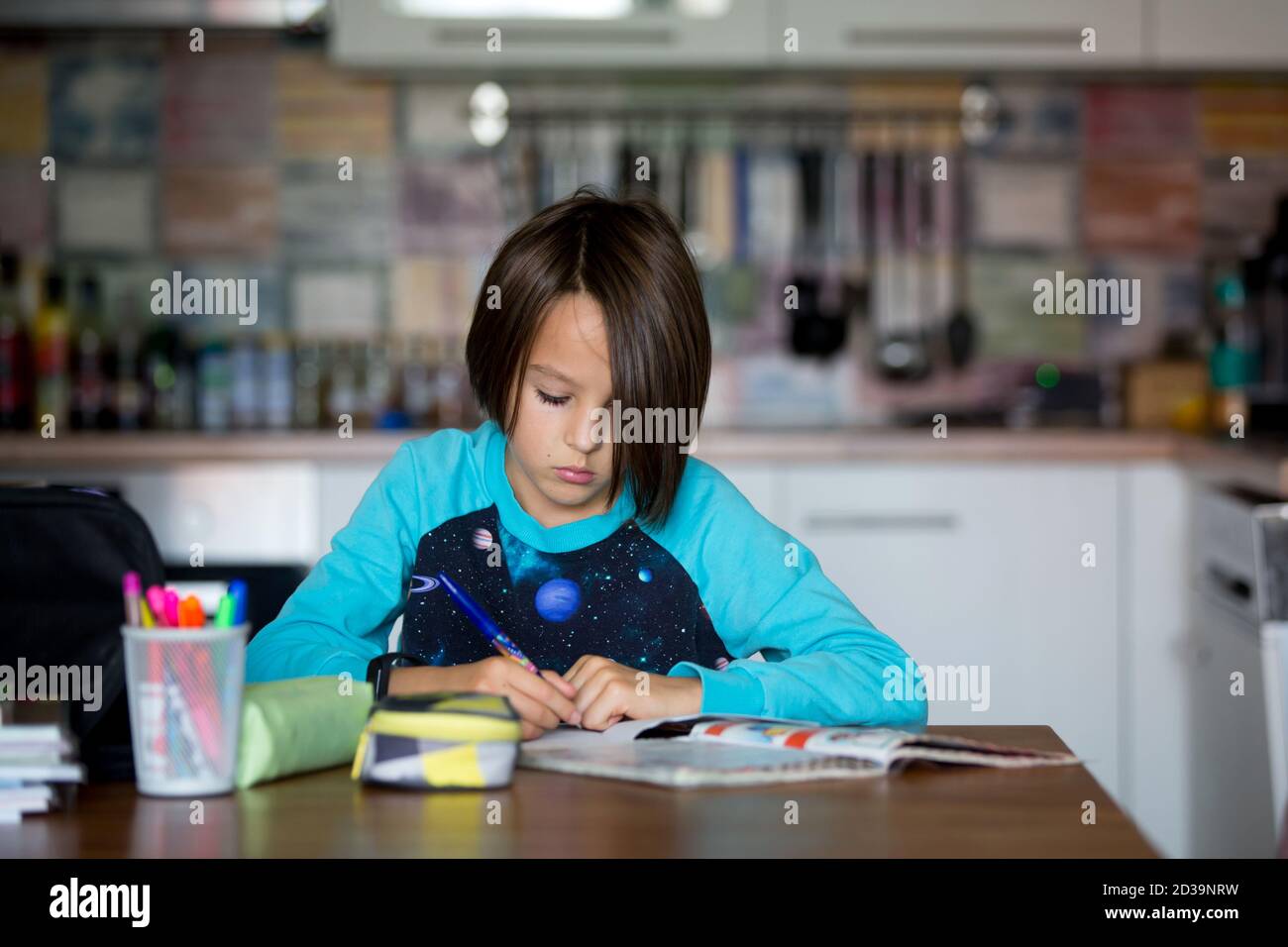 Child, writing homeworks, kid learning at home during pandemic Covid ...