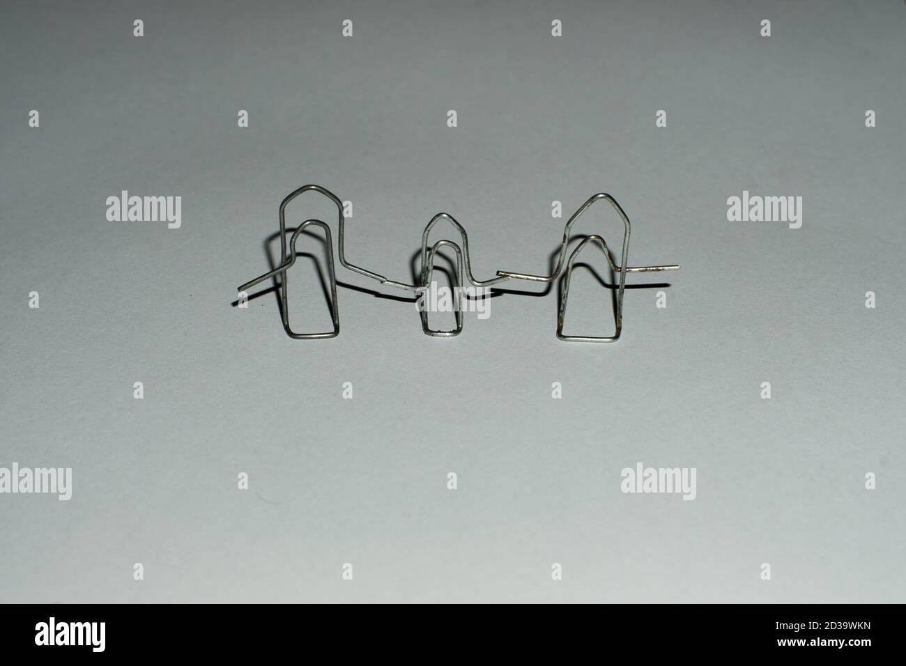 Image of silver paper clip isolated on white background Stock Photo - Alamy