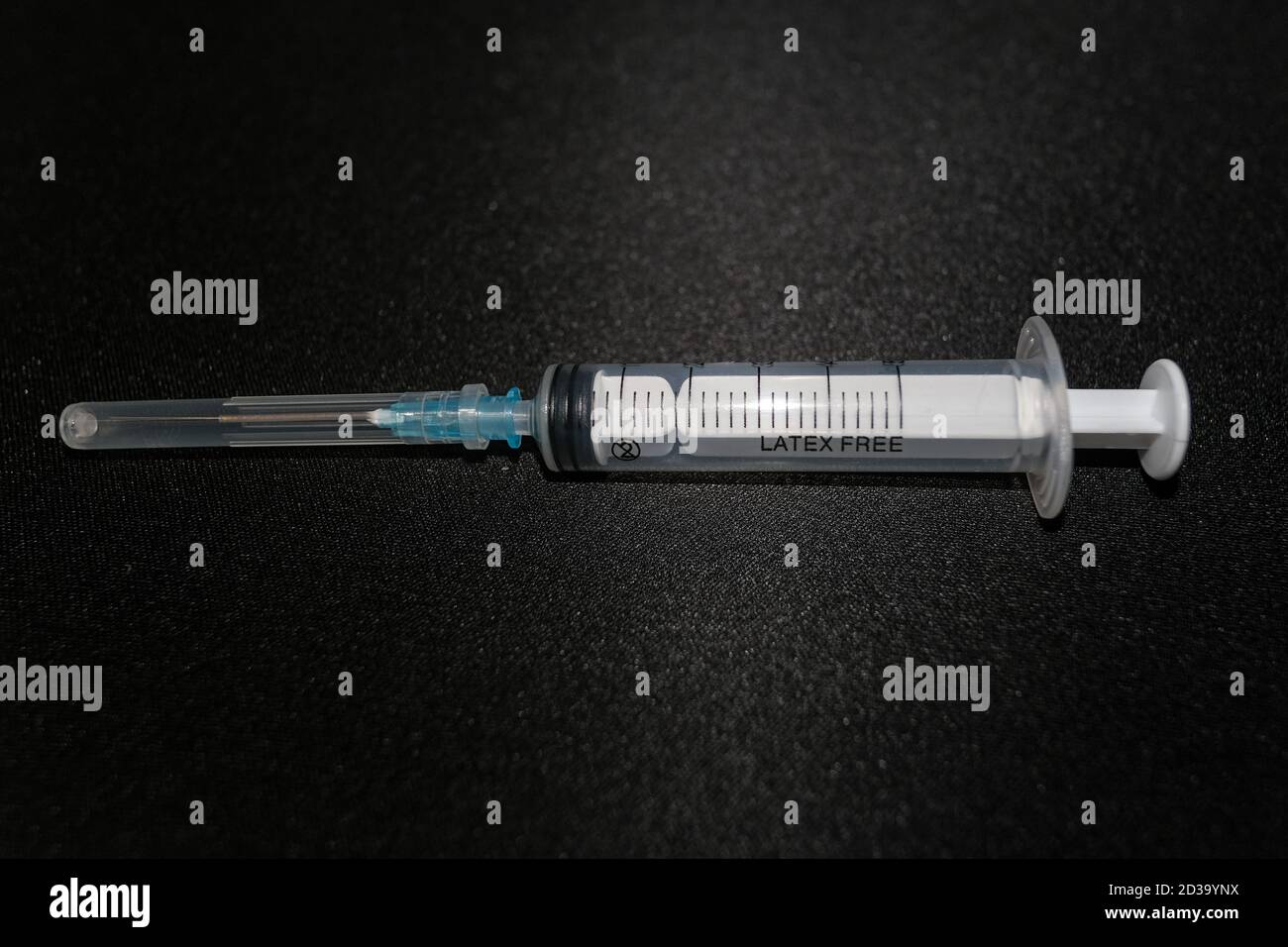 Medical disposable hypodermic syringe on black surface,Health care ...