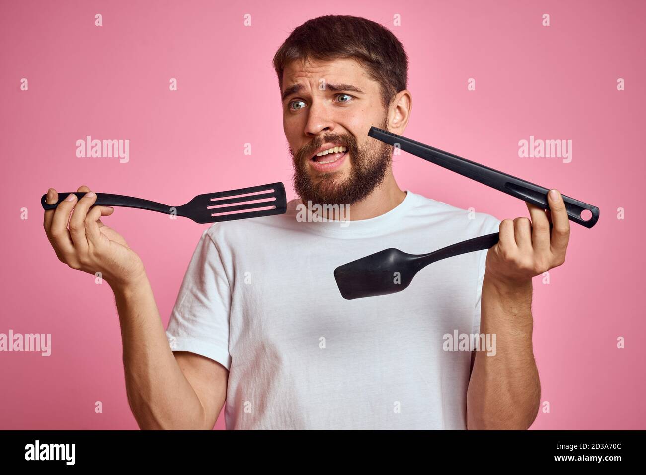 sad man with kitchen tools in hands scoop scoop emotions Stock Photo ...