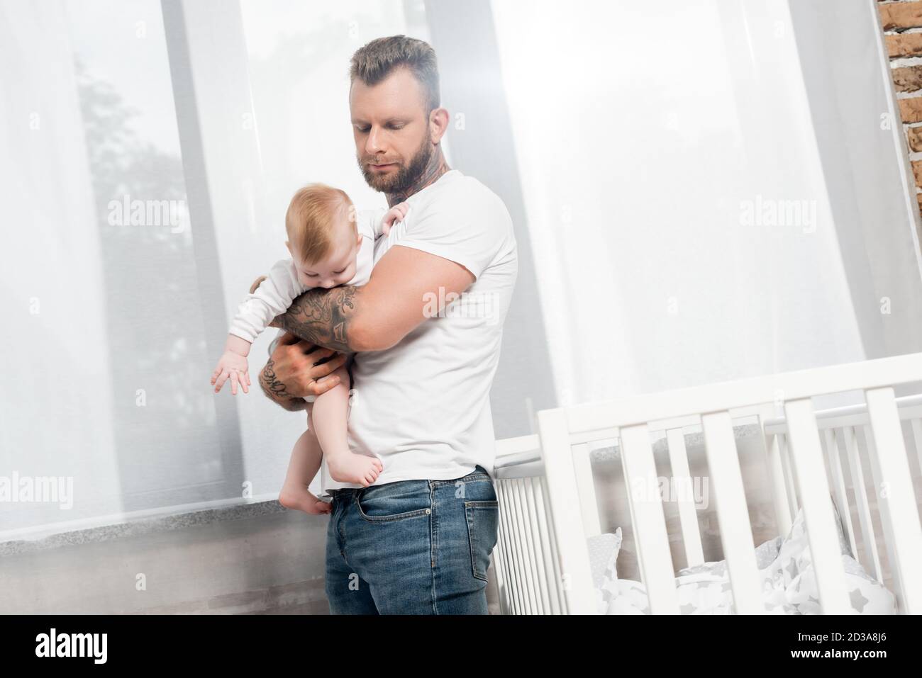 Man holding baby hi-res stock photography and images - Alamy