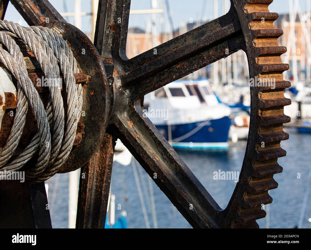 The Marina at Milford Haven Pembrokeshire, seen through a rusty winch ...