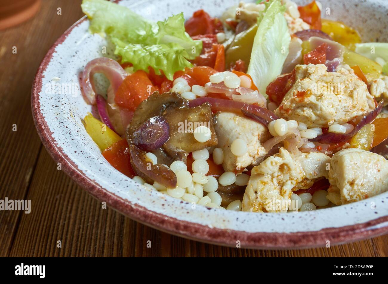 Israel Ptitim casserole with chicken and vegetables . Middle Eastern ...