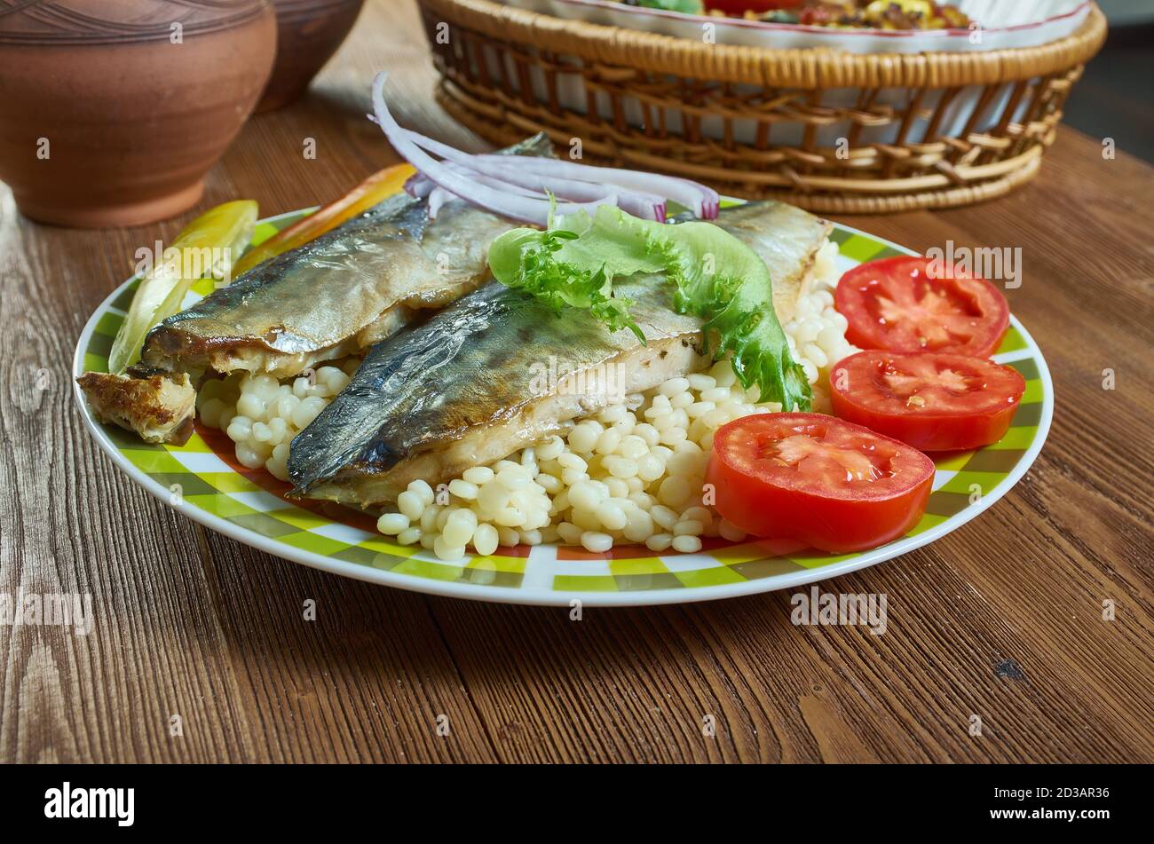 Israeli Fried mackerel fish with Ptitim close up Mediterranean cuisine ...