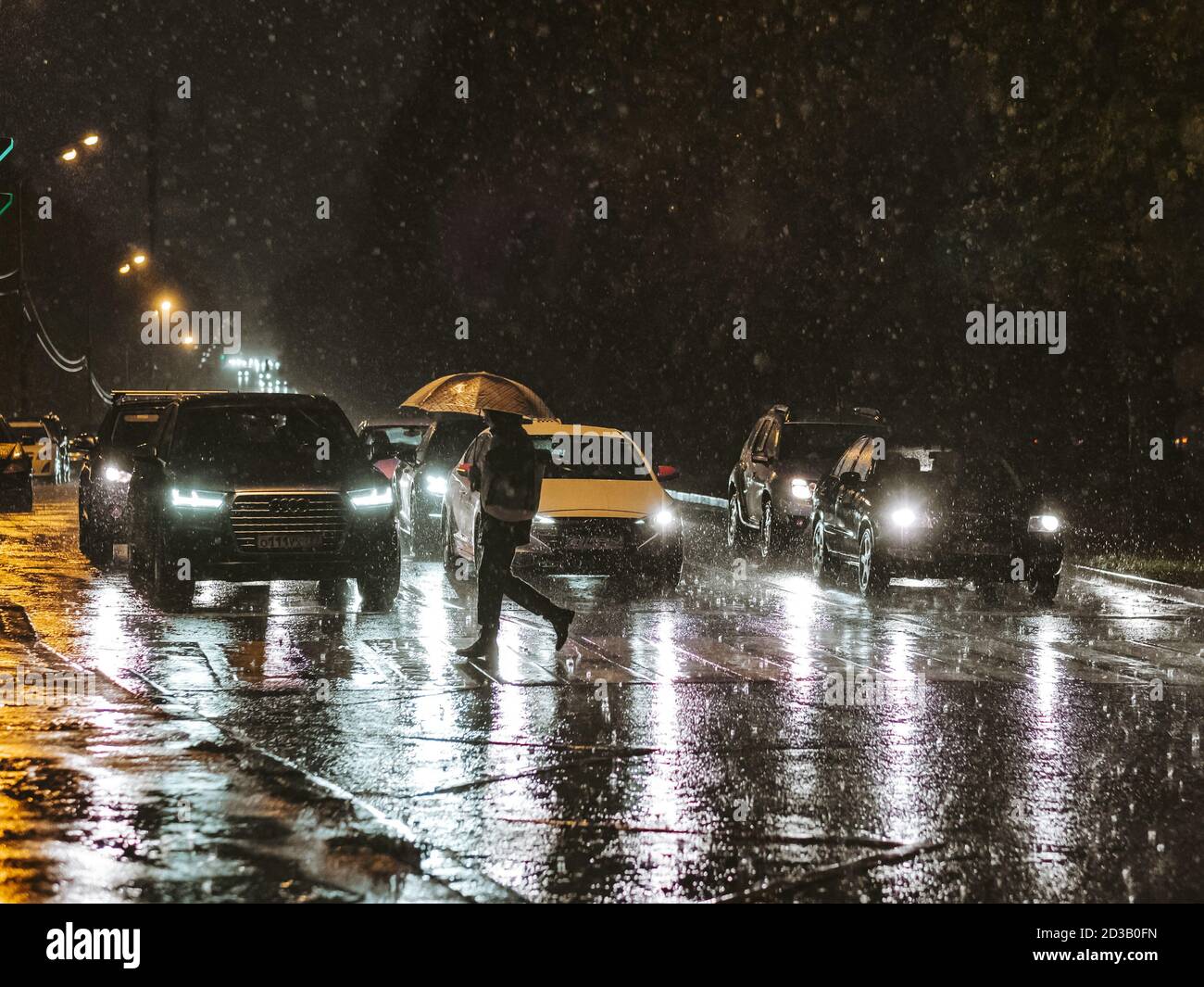 Man heavy rain hiding hi-res stock photography and images - Alamy