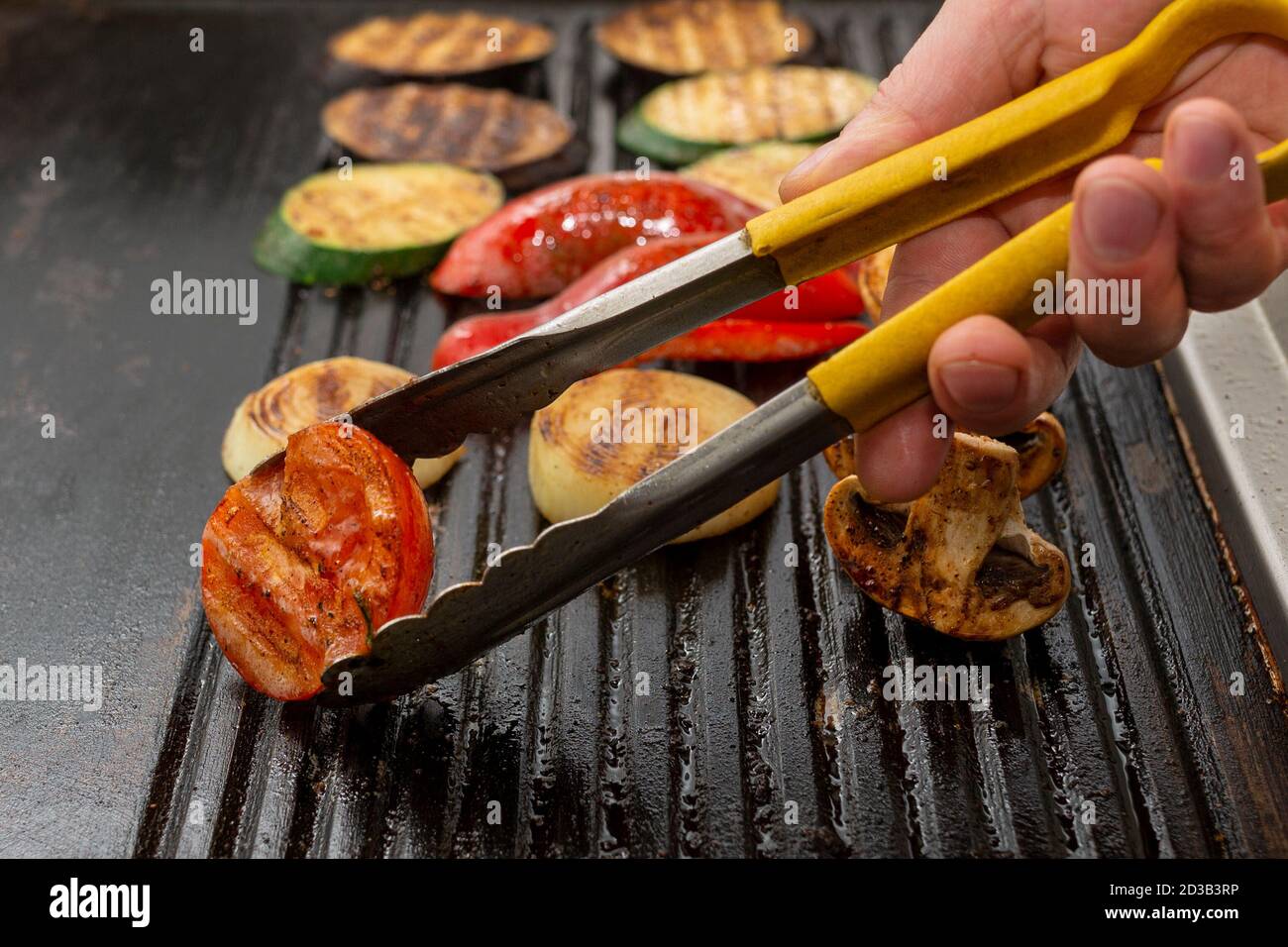 Cooking vegetables grill on the frying surface in black Stock Photo - Alamy