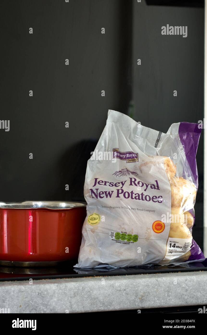 Bag of Jersey Royal New Potatoes With Saucepan On a Cooker Hob, UK ...