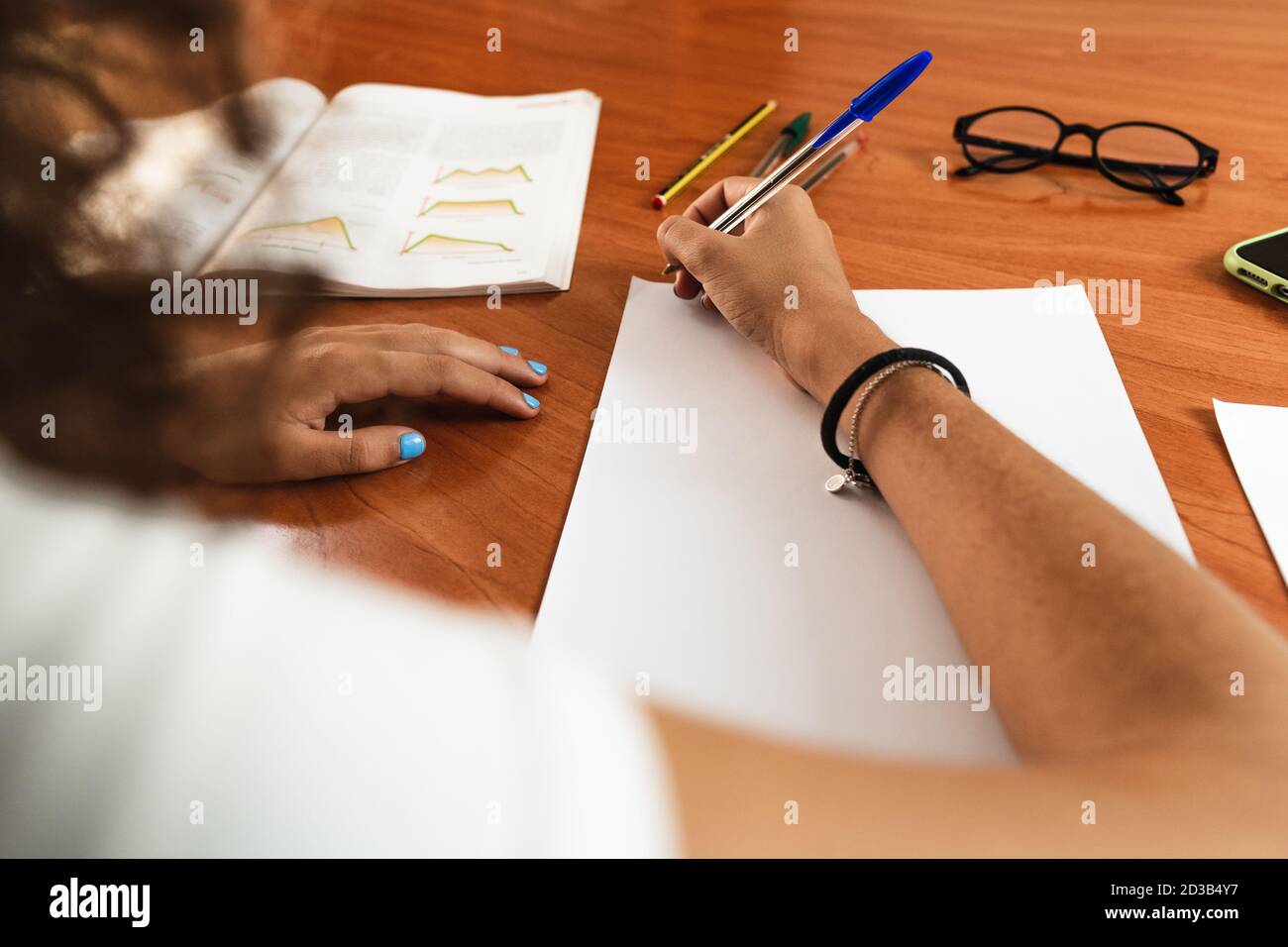 Female student doing classes Stock Photo - Alamy