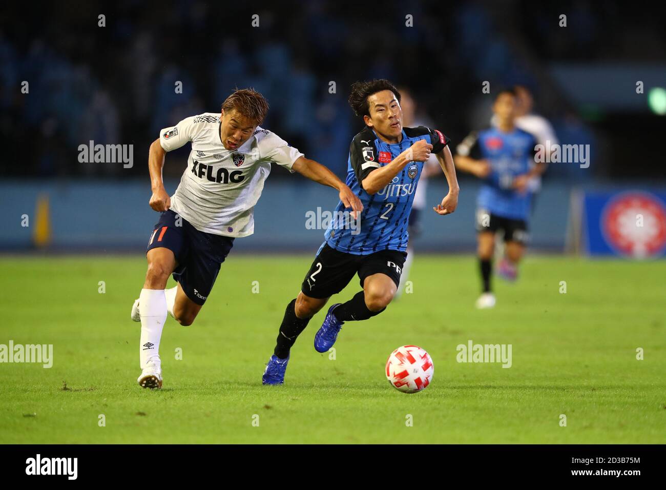 FC Tokyo's Kensuke Nagai (L) and Frontale's Kyohei Noborizato during the 2020 J. League YBC ...