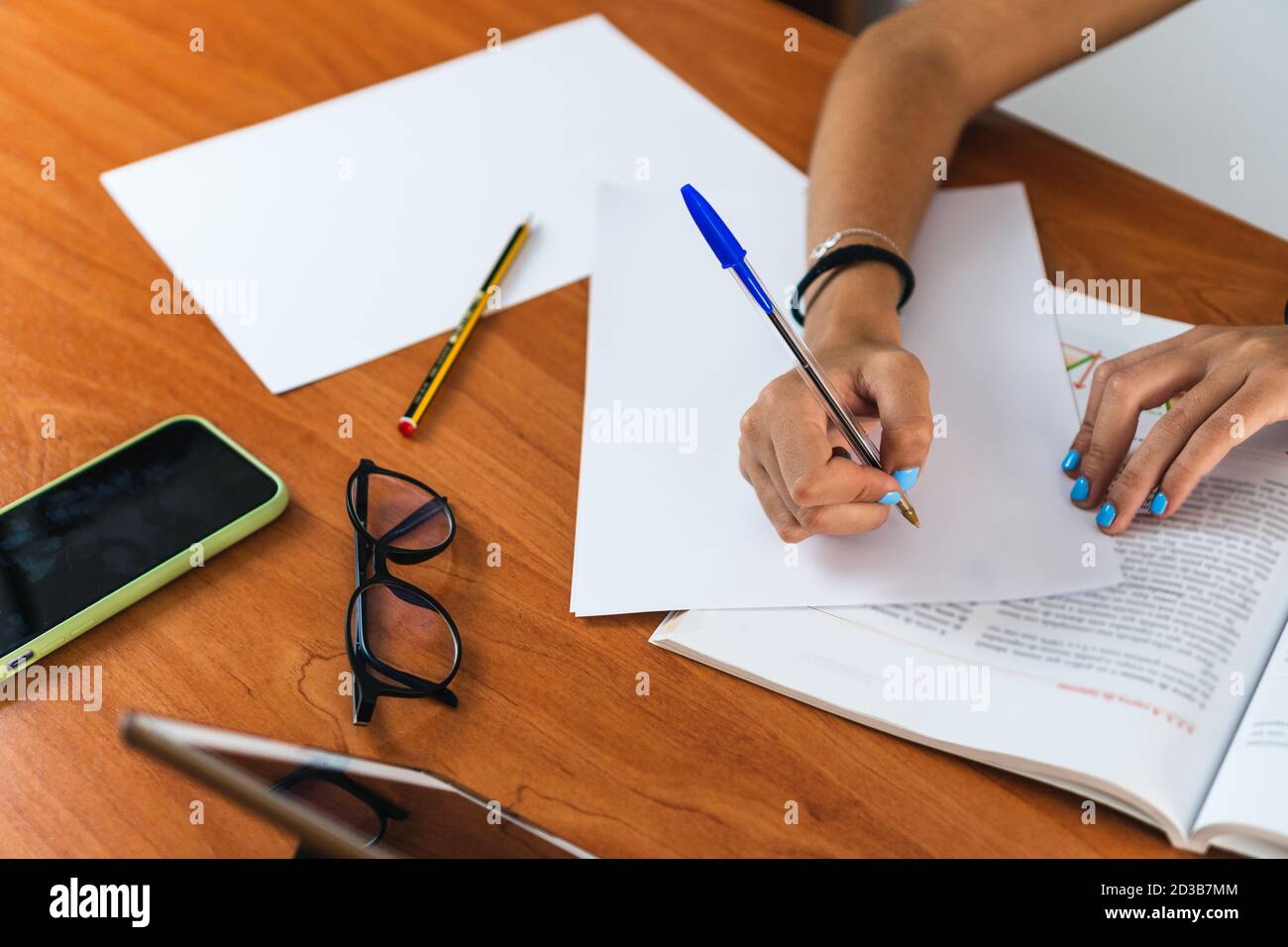 Female student doing classes Stock Photo - Alamy