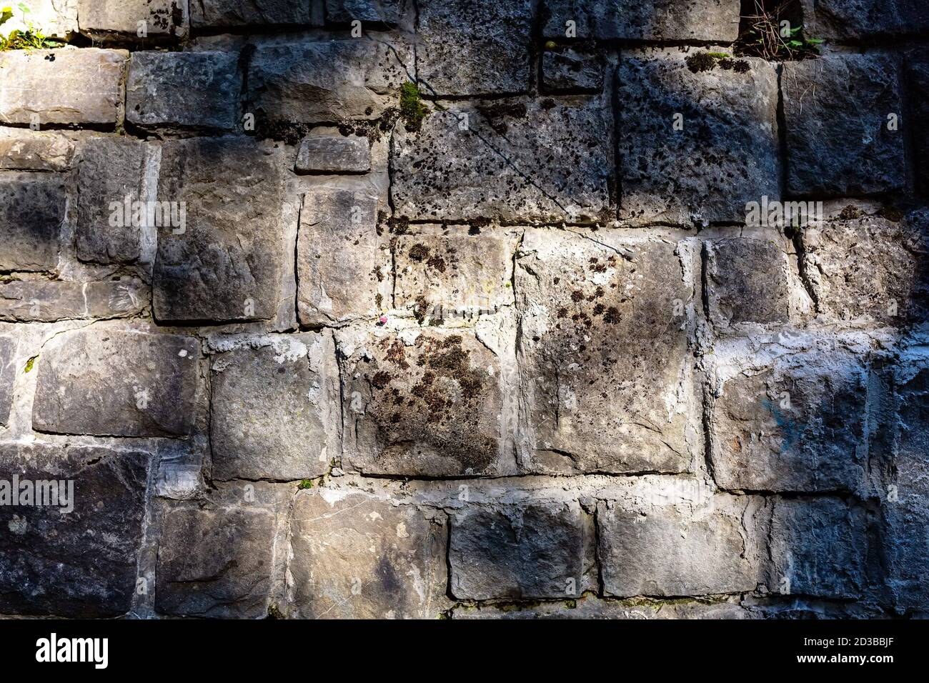 Background of stone wall texture. The surface of the stones is brown ...