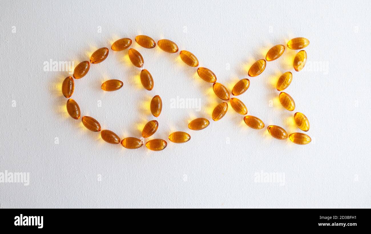 Fish shape Omega 3 capsule. Health care and medical concept Stock Photo ...