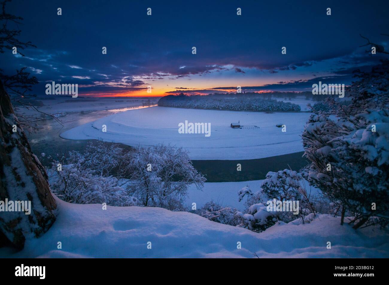 Winter sunset over the River Tweed looking across the border into ...