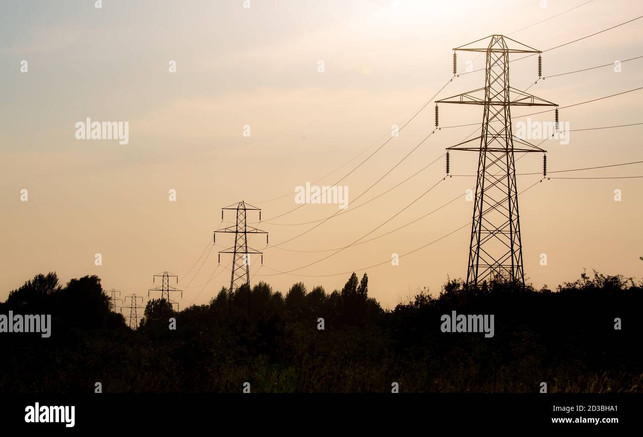 Beautiful view of electric towers during the sunrise Stock Photo - Alamy