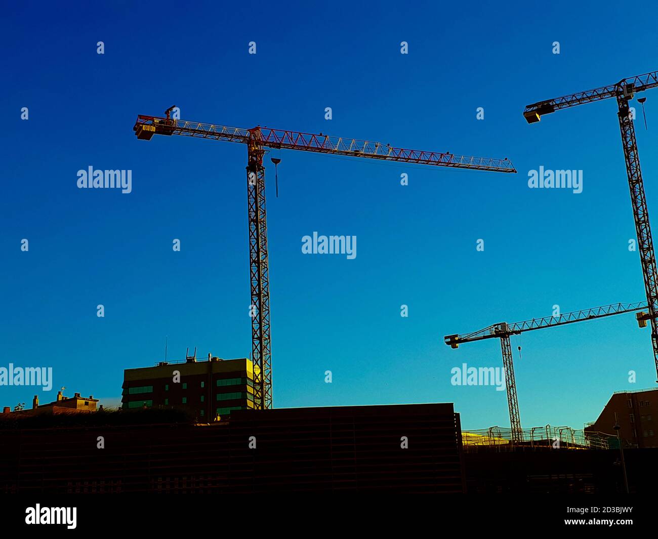 Cranes, Under construction buildings Stock Photo - Alamy
