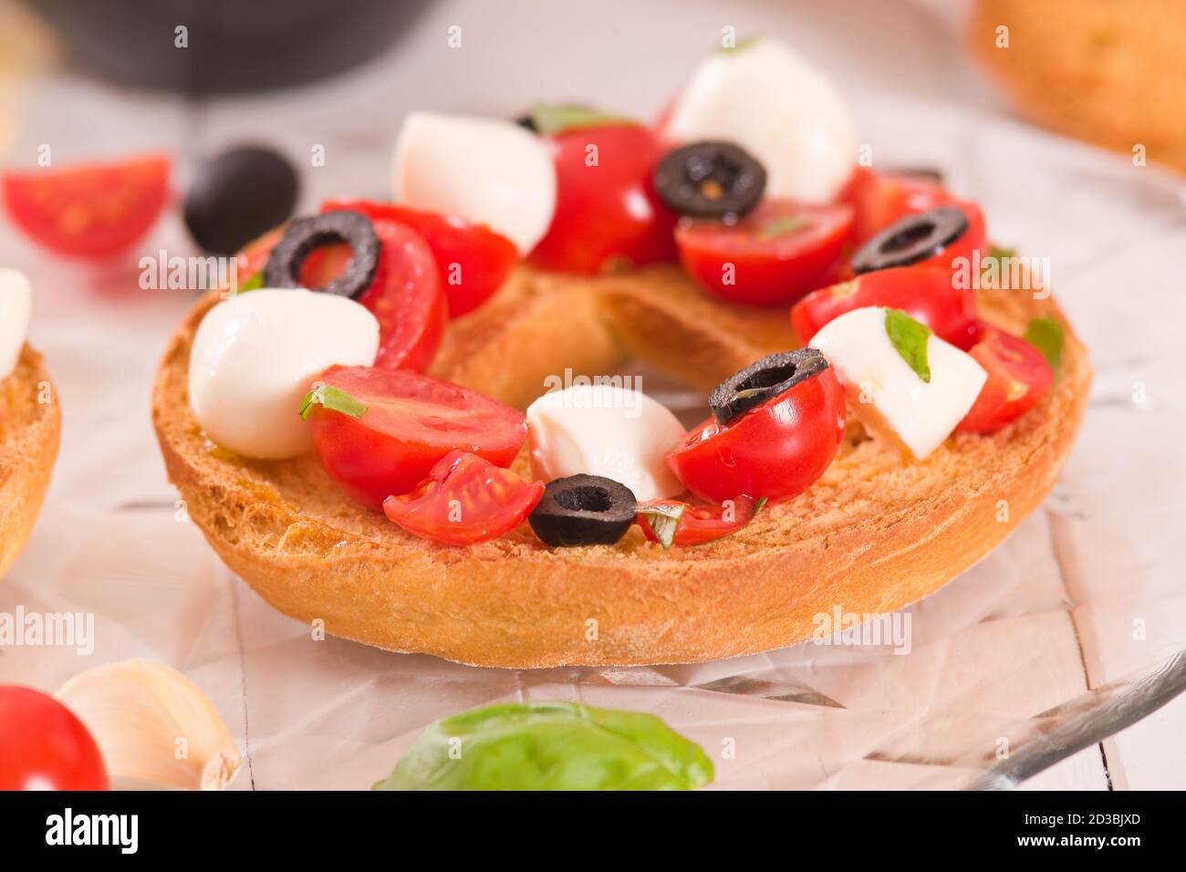 Friselle with tomatoes and mozzarella cheese Stock Photo - Alamy