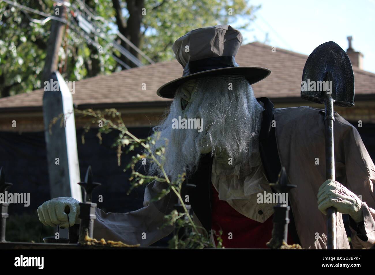 Halloween imagery of a nightmarish haunted graveyard and an old man ...