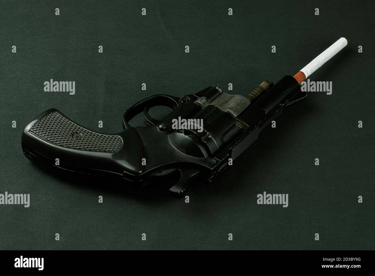 concept of harm to smoking, smoking kills, cigarette sticks out of gun ...