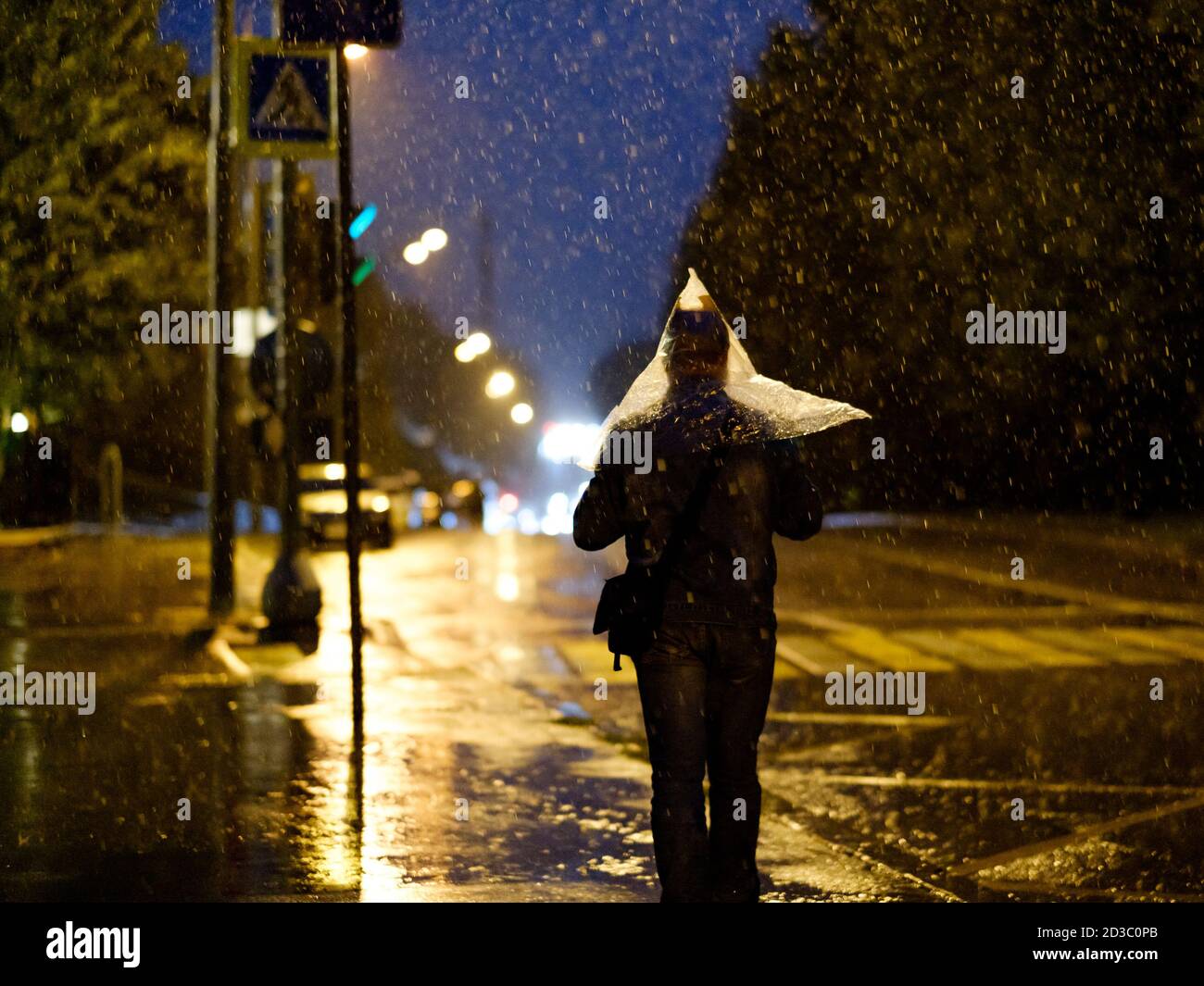 Man heavy rain hiding hi-res stock photography and images - Alamy
