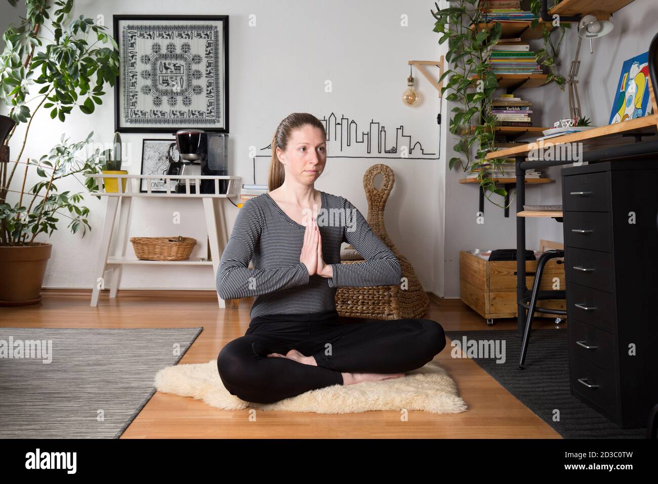 Young woman does exercises from home during quarantine time Stock Photo ...