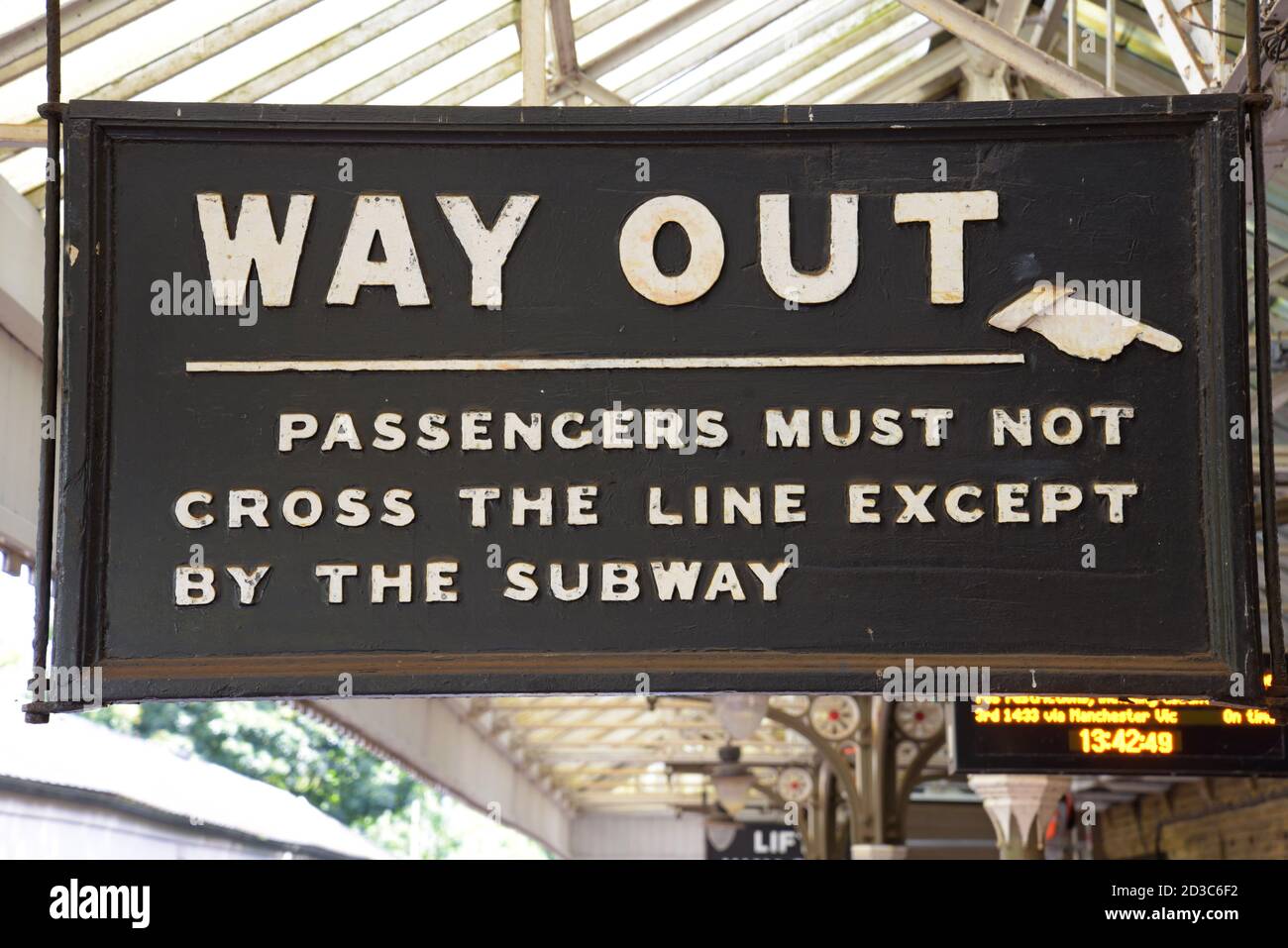 Vintage Way Out sign with finger pointing the direction on the platform ...