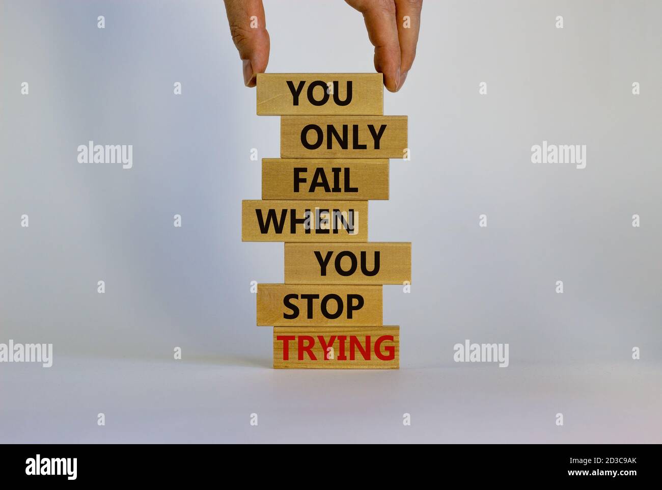 Concept of building success foundation. Men hand put wooden blocks on ...