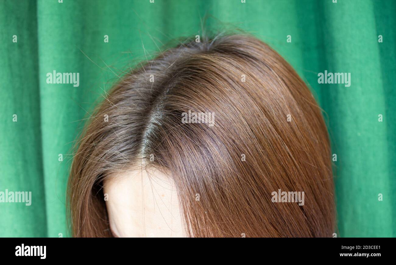 Women's hair after washing on a green background.the view from the top ...
