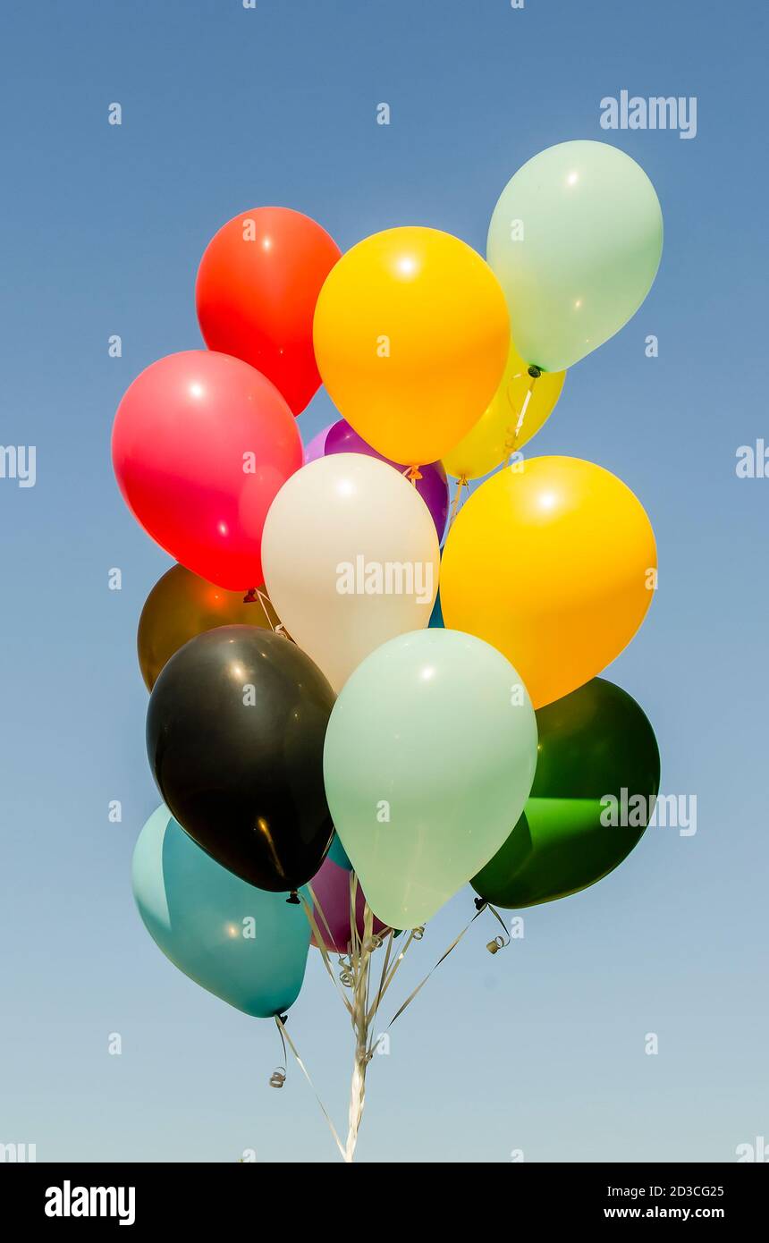 Colorful bunch of helium balloons isolated on background Stock Photo ...
