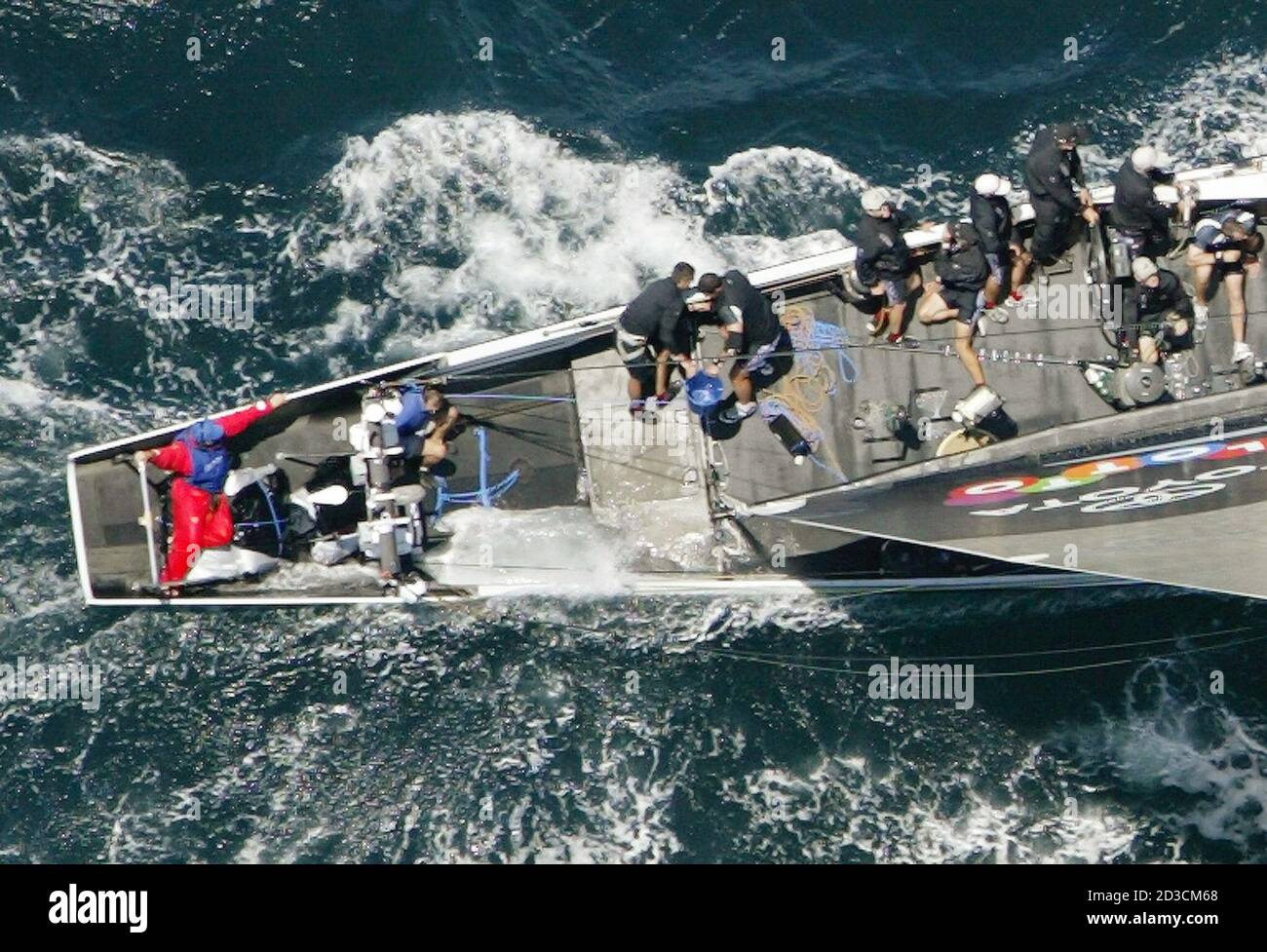 CREWMEN BAIL WATER OUT OF TEAM NEW ZEALAND'S YACHT DURING AMERICA'S CUP ...