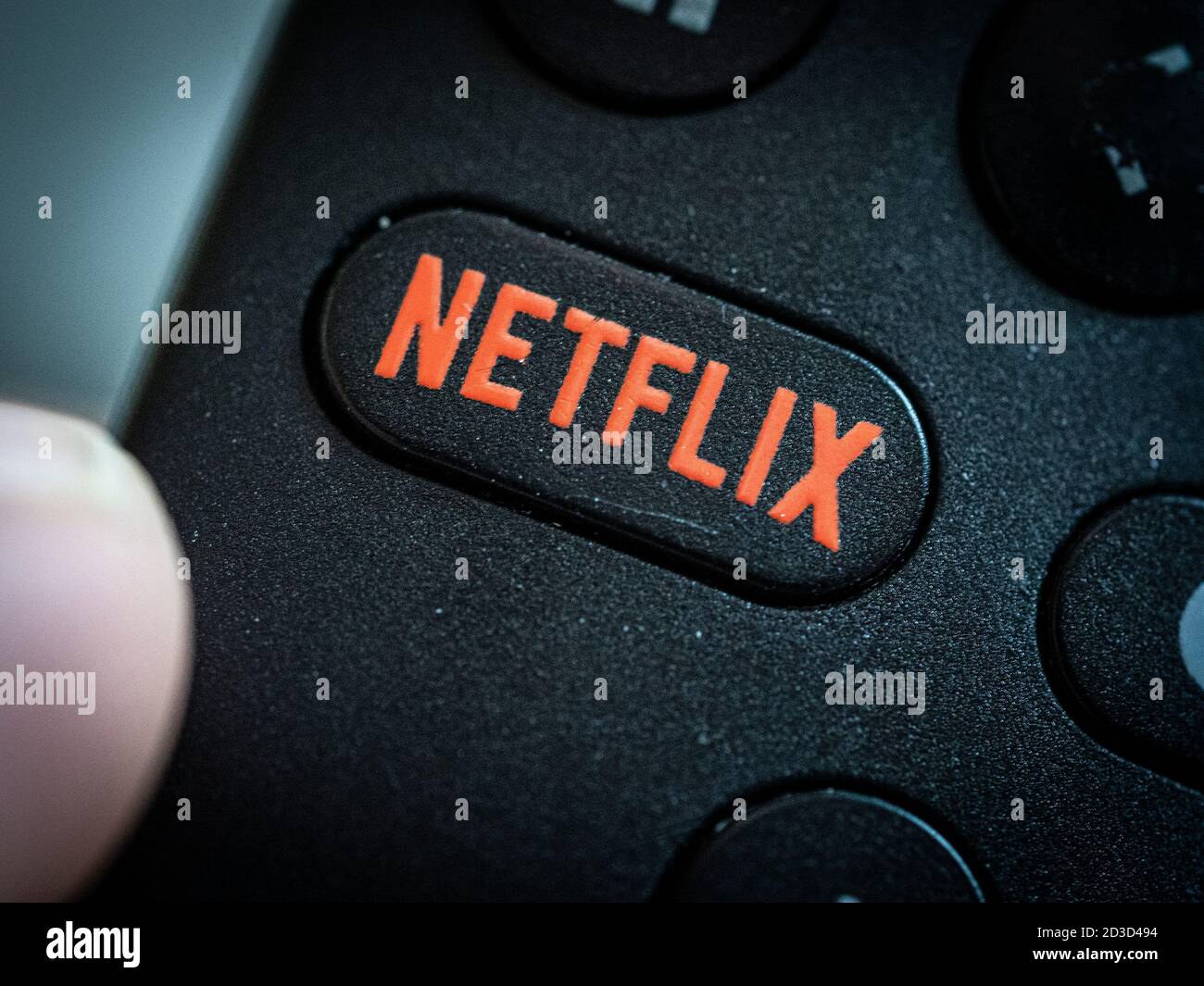 Extreme close up on Netflix remote control tv button Stock Photo - Alamy