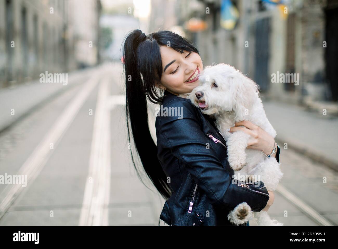 Asian lady holding dog hi-res stock photography and images - Alamy