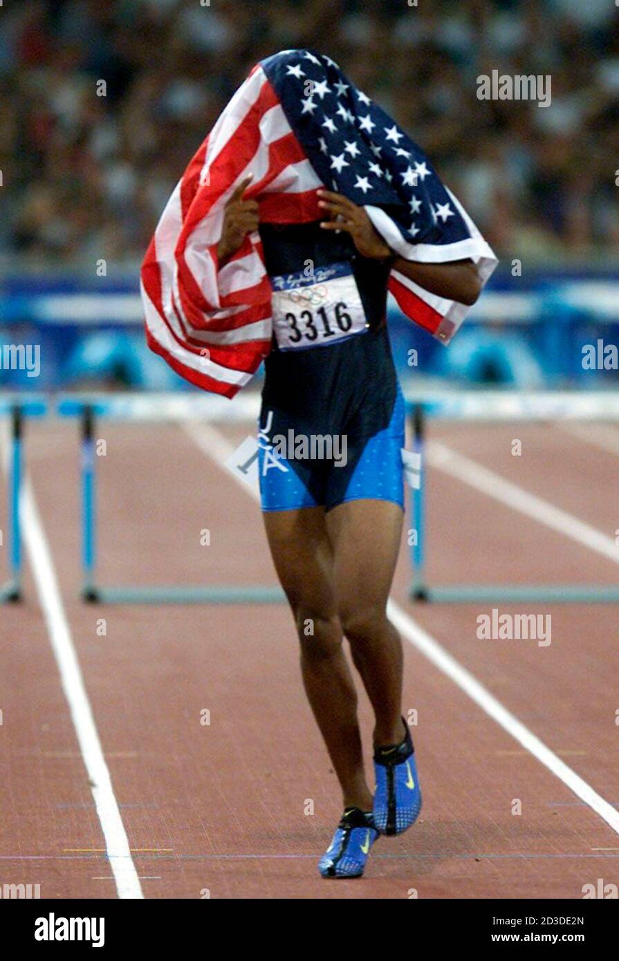 Angelo taylor celebrates winning the mens 400m hurdles hi-res stock ...