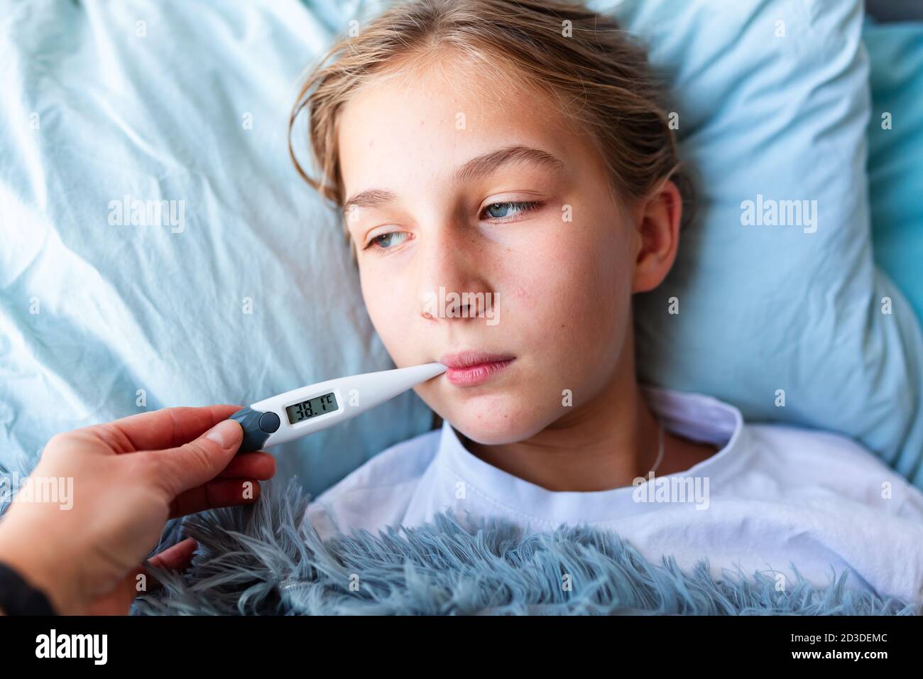 Sick girl laying in bed hi-res stock photography and images - Alamy