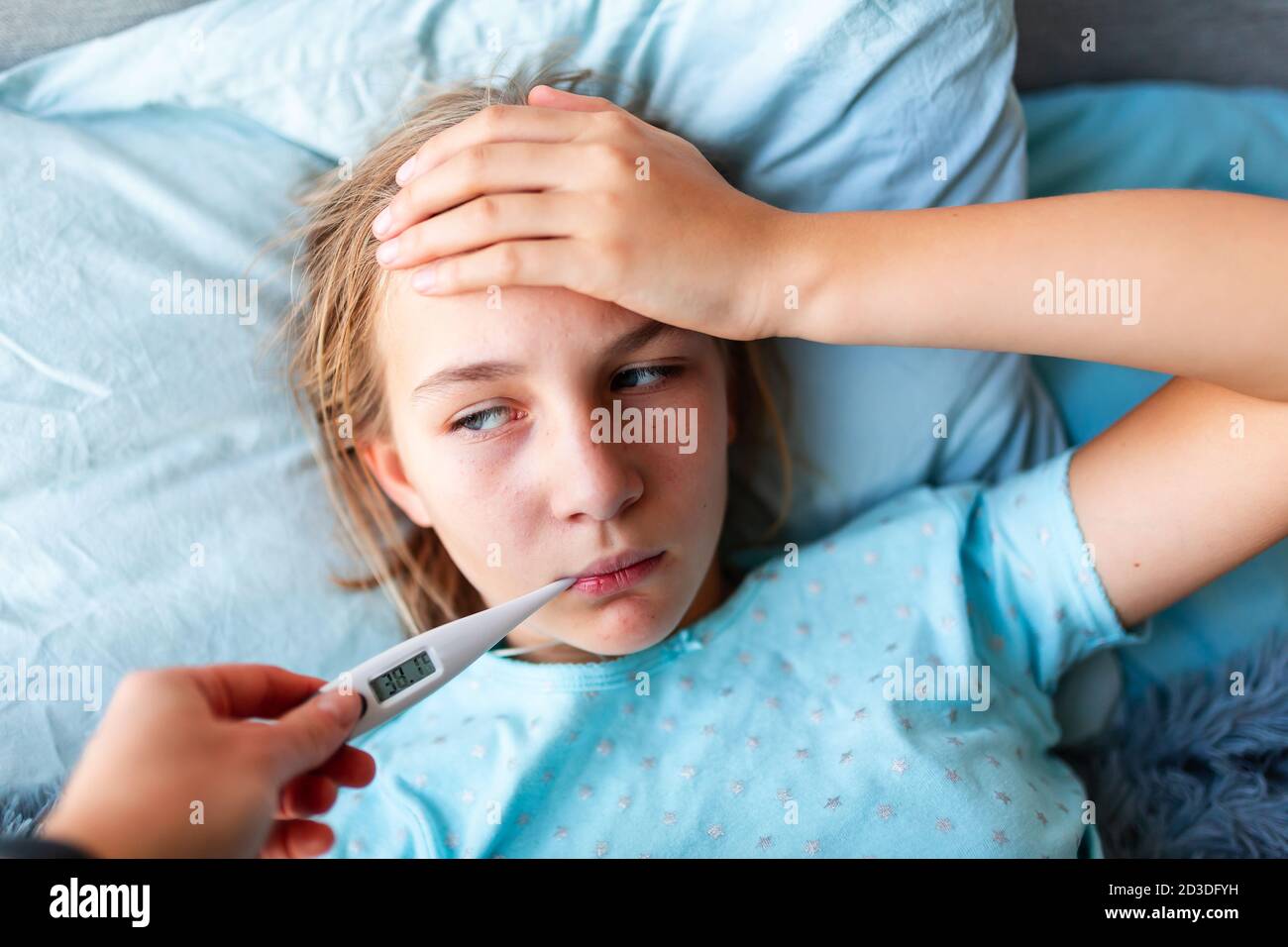 Teenager fever thermometer hi-res stock photography and images - Alamy