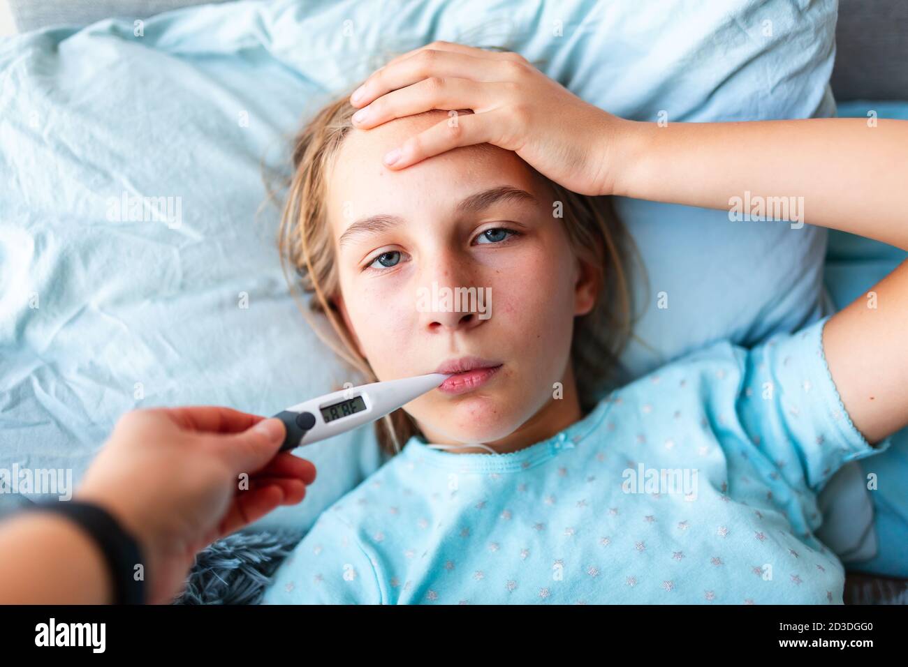 Teenager fever thermometer hi-res stock photography and images - Alamy