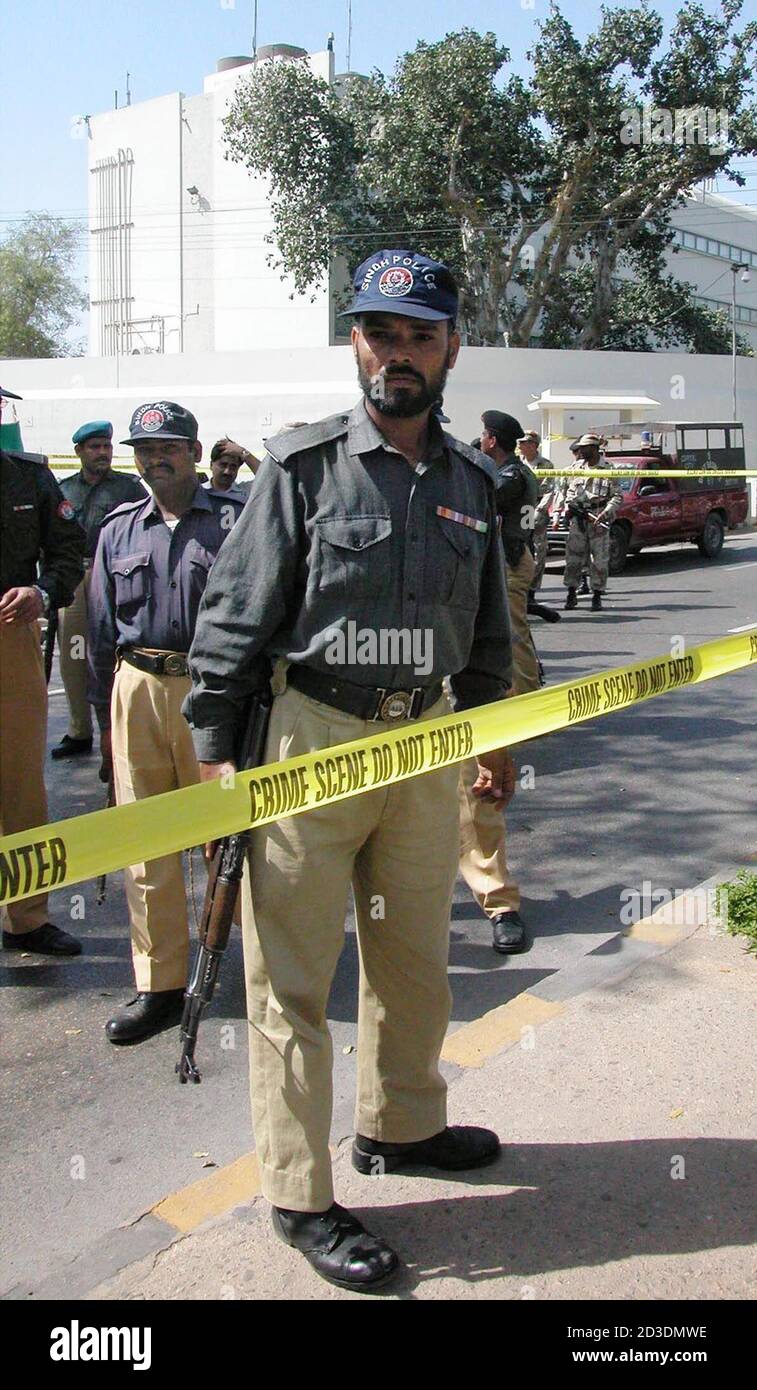 Pakistani police officers stand guard hi-res stock photography and ...