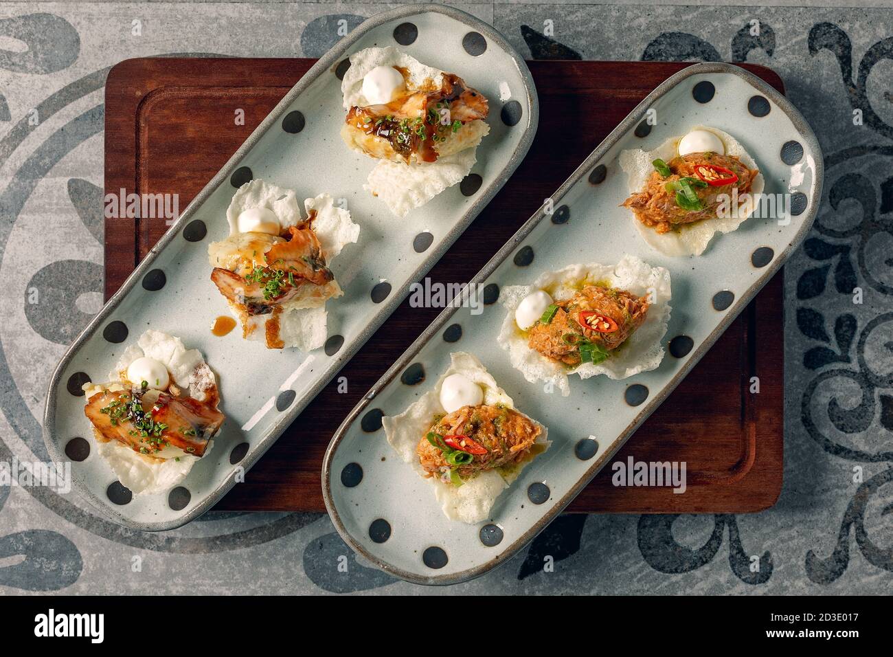 Spanish bite selection served on two ceramic plate Stock Photo - Alamy