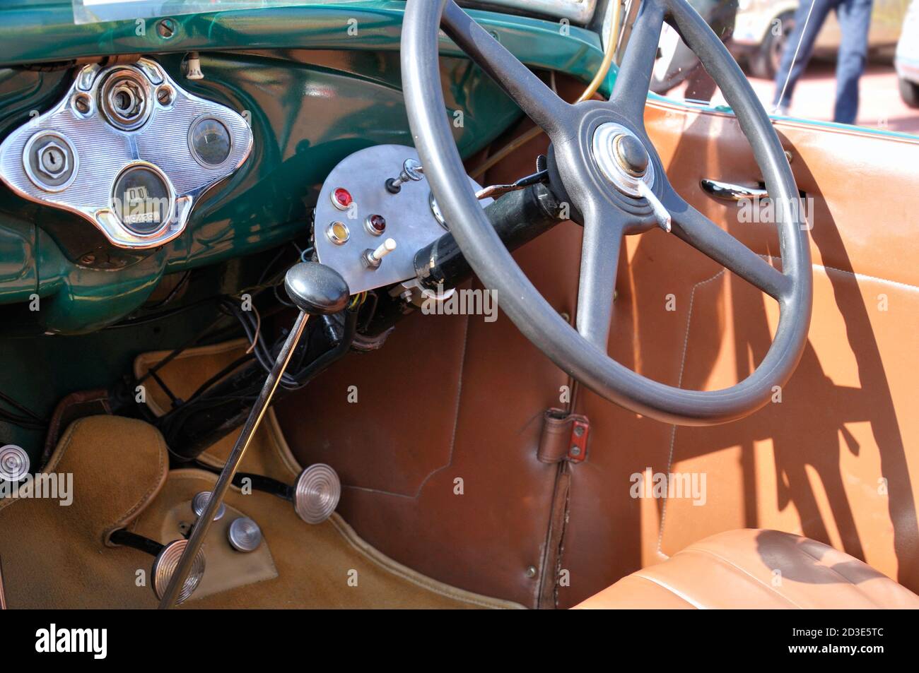 Driver's cockpit of a green classic car Stock Photo - Alamy