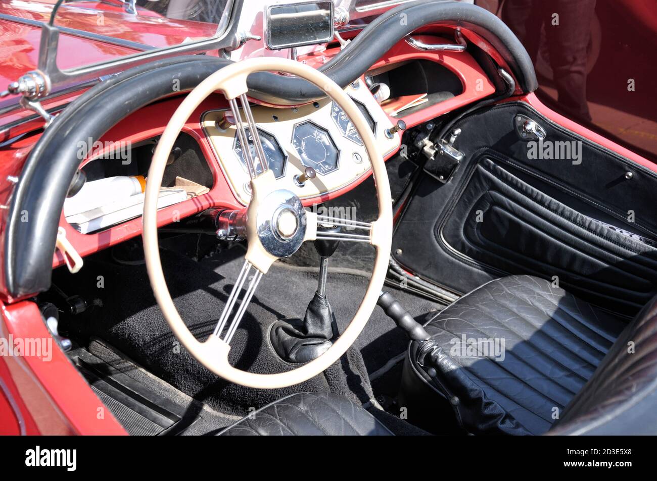 Driver's cockpit of a red classic car Stock Photo - Alamy
