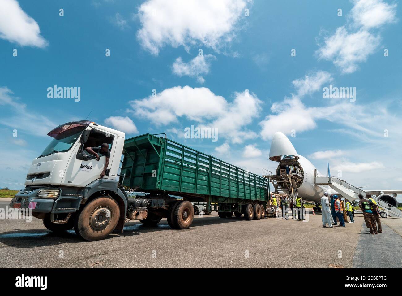 Livestock in wooden boxes being offloaded by a high-loader from a 747 ...